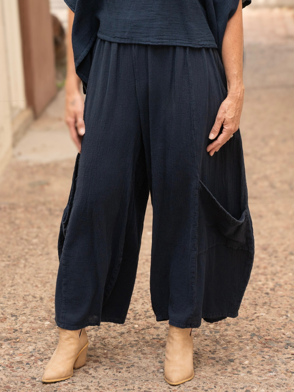 Conscious Coterie Lucy pant in navy blue close up photo of the front of ...